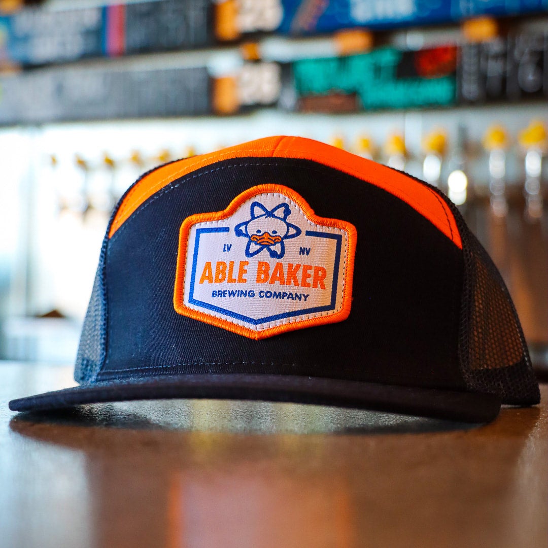 Hat - 7-Panel Navy Blue and Orange Snap-Back | Able Baker Brewing